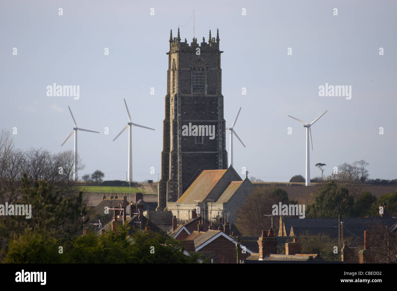 Church with wind turbines Stock Photo - Alamy