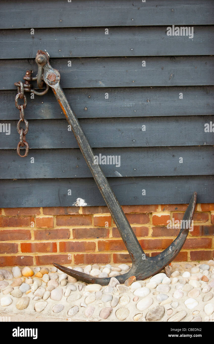 Anchor by a wall Stock Photo - Alamy