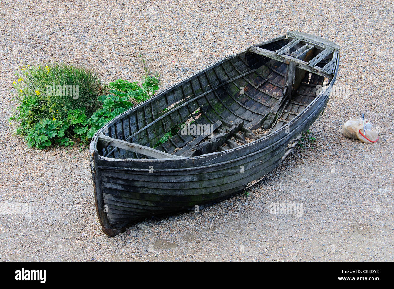 Old wooden rowing boat on the beach UK Stock Photo - Alamy