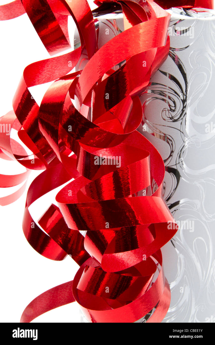 Red Ribbon and Packing Paper closeup on white Stock Photo - Alamy