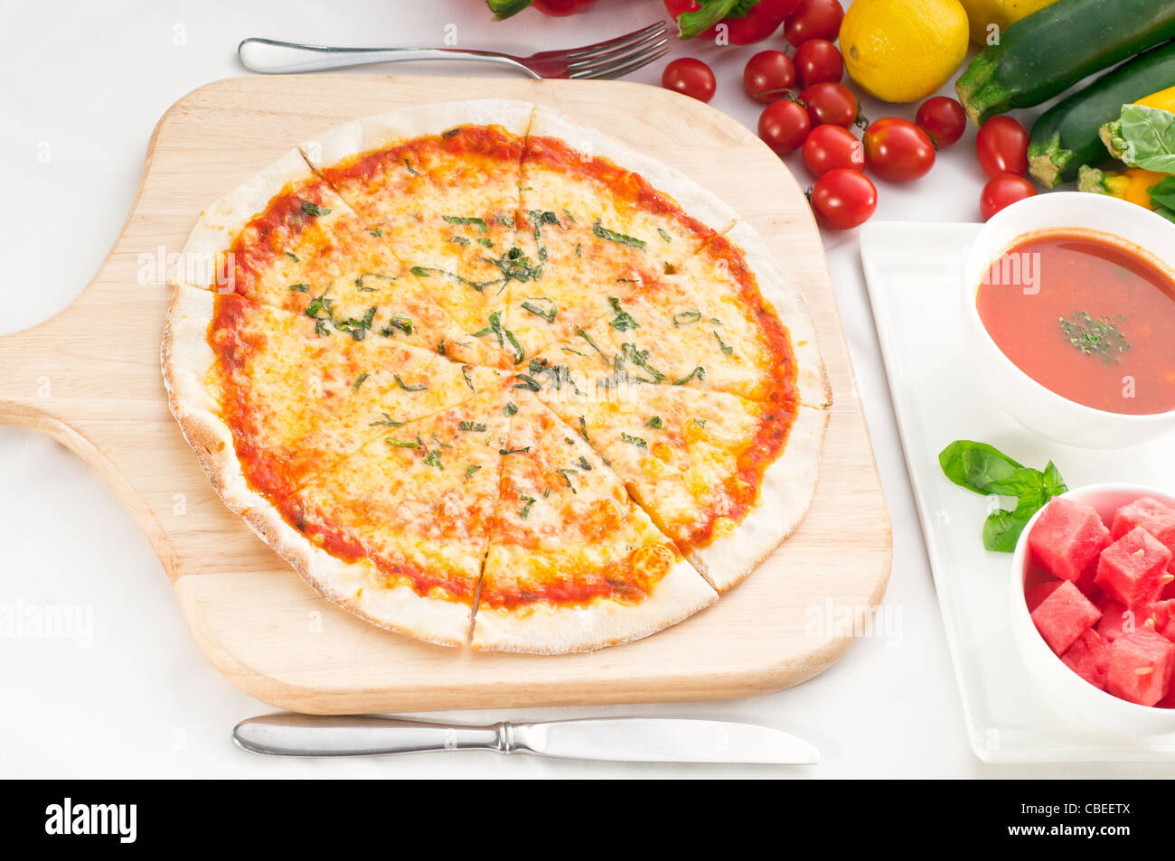 Italian original thin crust pizza Margherita with gazpacho soup and ...