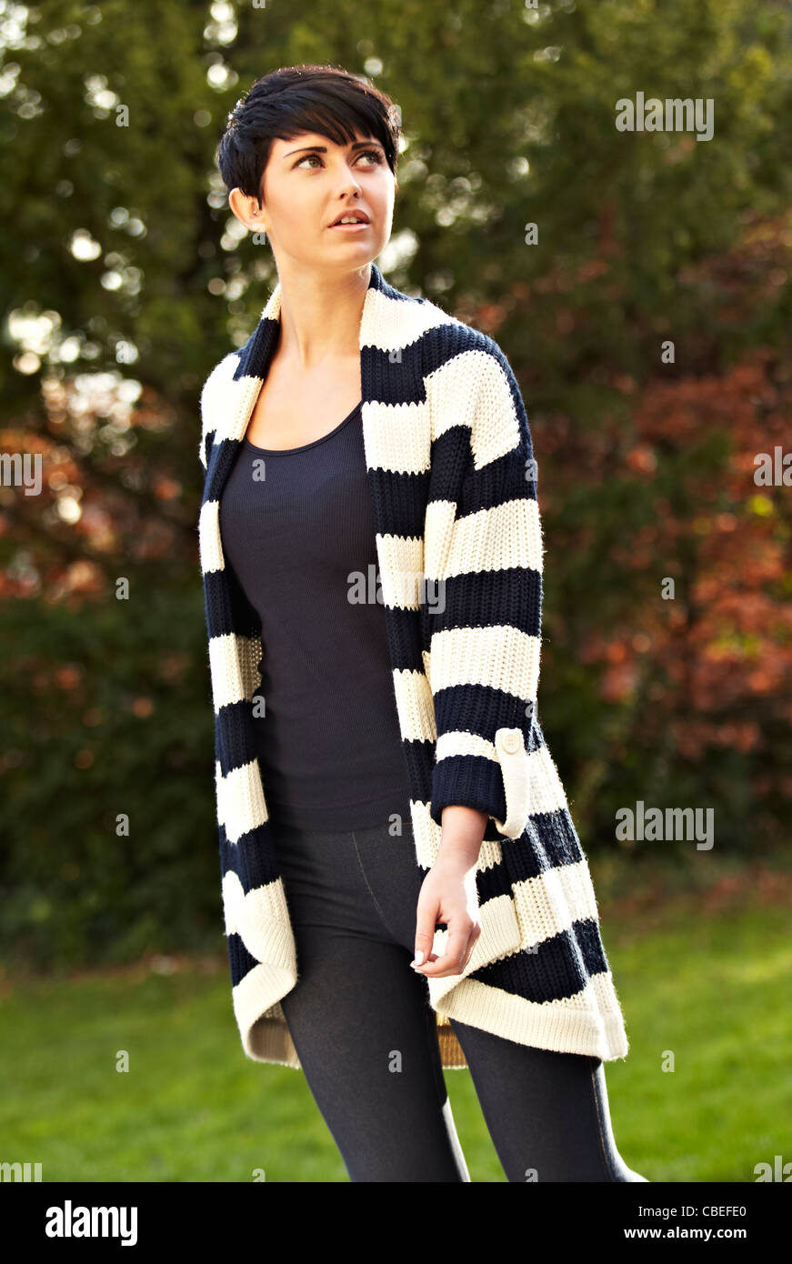 Girl walking outdoors Stock Photo - Alamy