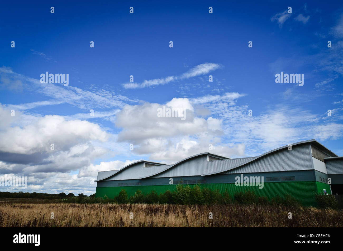 An industrial scene with vivid blue sky overhead Stock Photo - Alamy