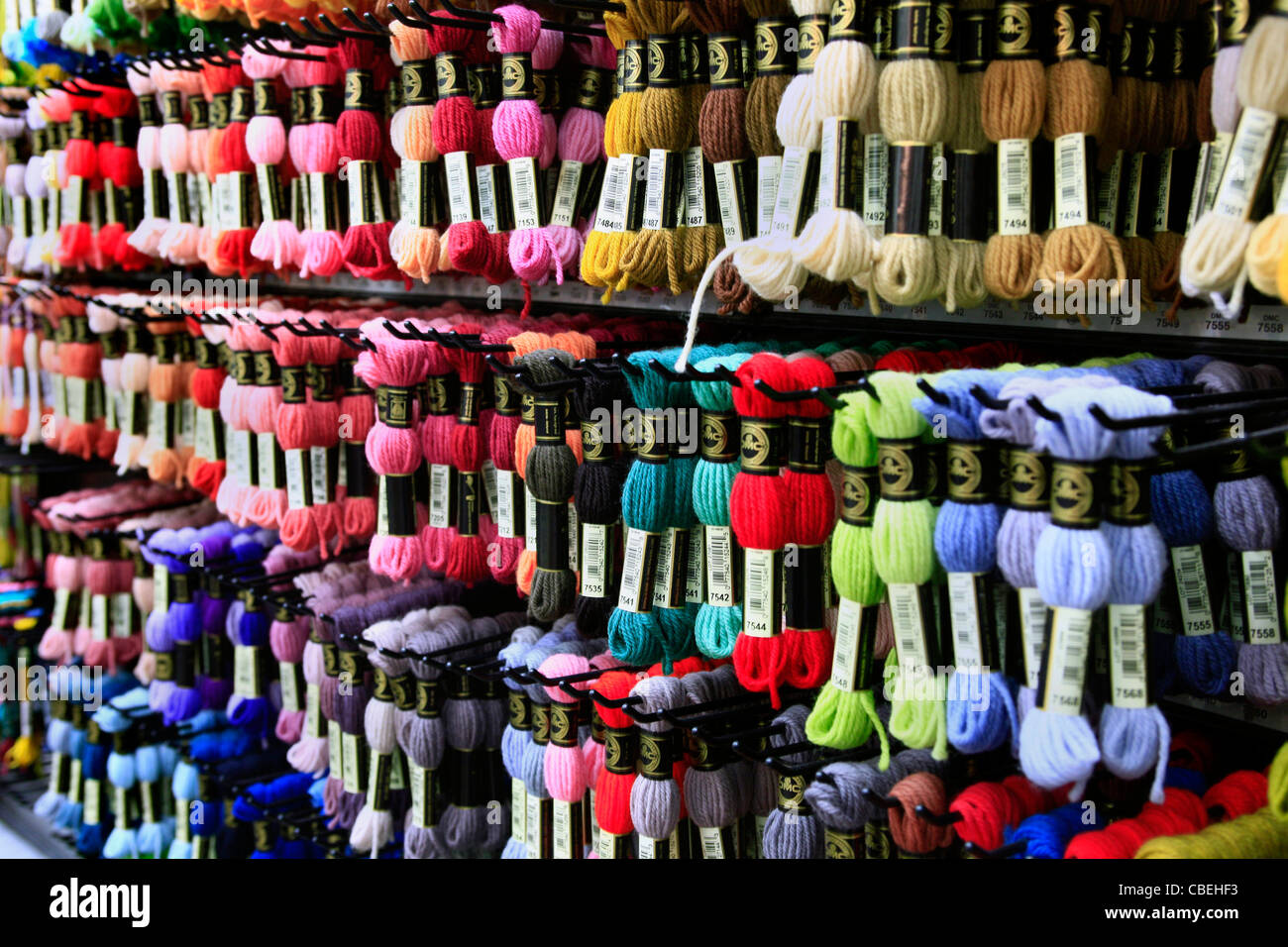 Colour of wool - a display of woolen threads for sewing Stock Photo - Alamy
