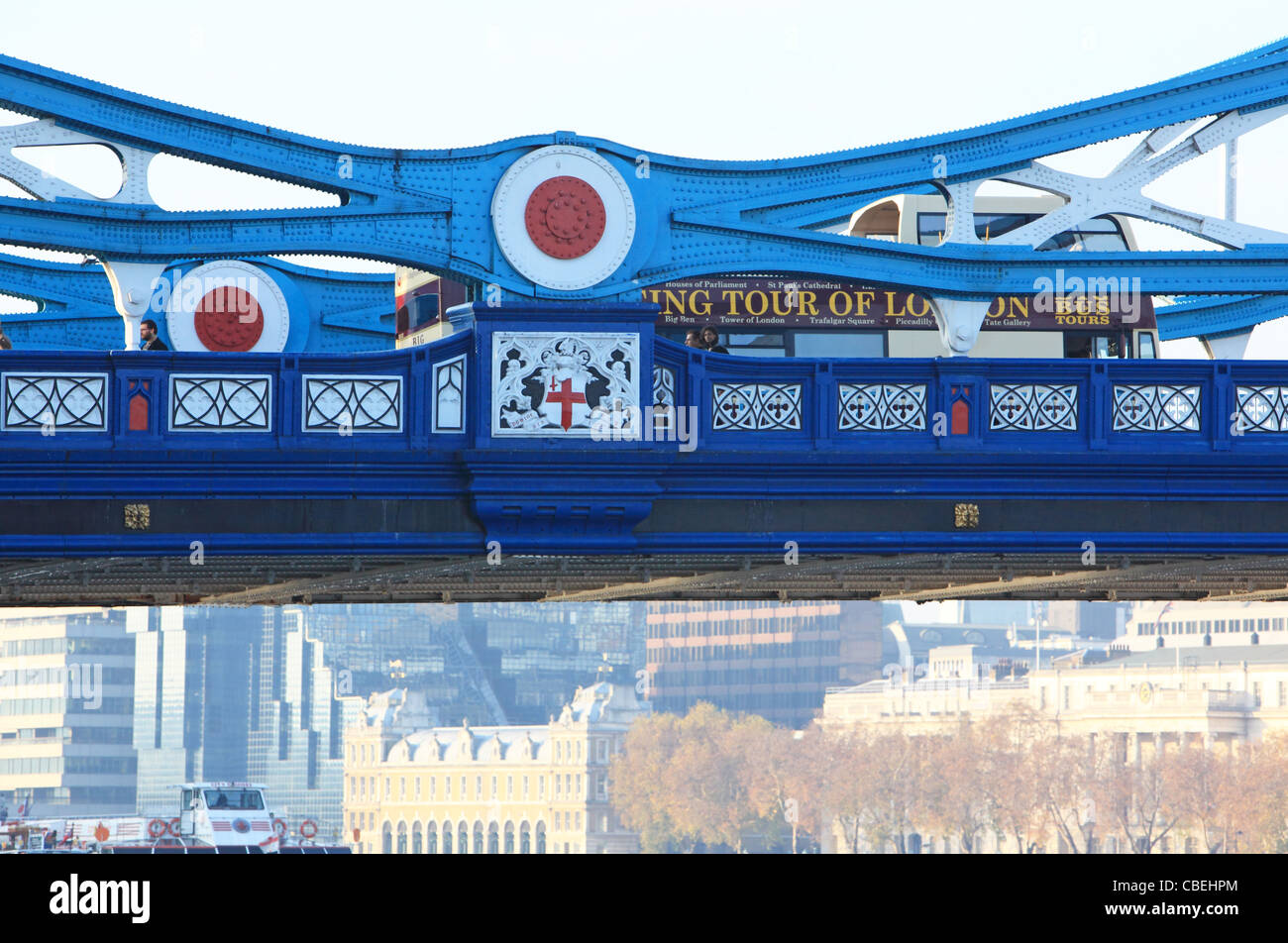 London tour bus crossing Tower Bridge in London, England, UK Stock ...