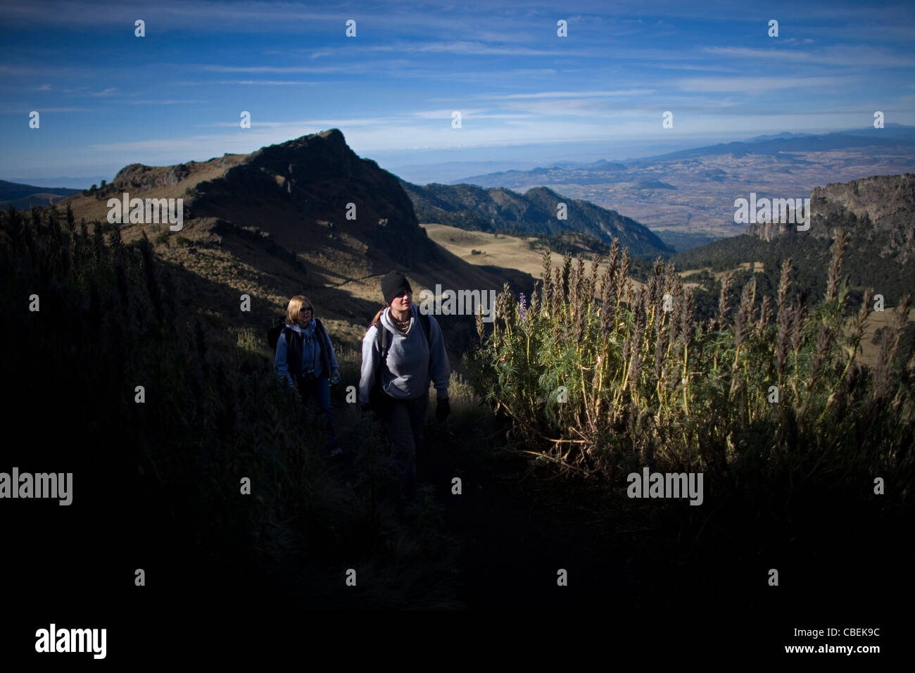 Tourists walk during a trekking trip to the Volcano "Ixta" in the ...