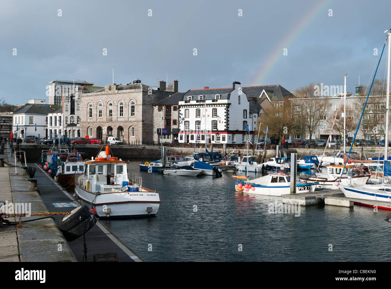 Boats moored in front of Custom House at Sutton Harbour in Plymouth ...
