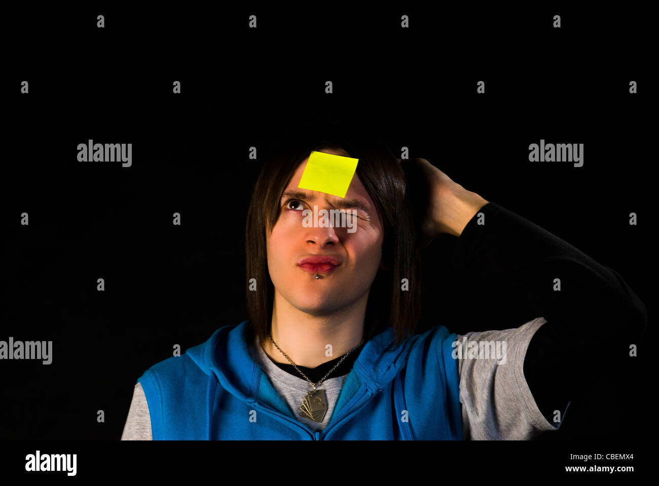 Forgetful guy with a sticky note on his forehead, a concept Stock Photo ...