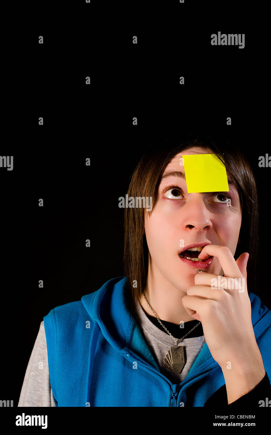 Forgetful guy with a sticky note on his forehead, a concept Stock Photo ...