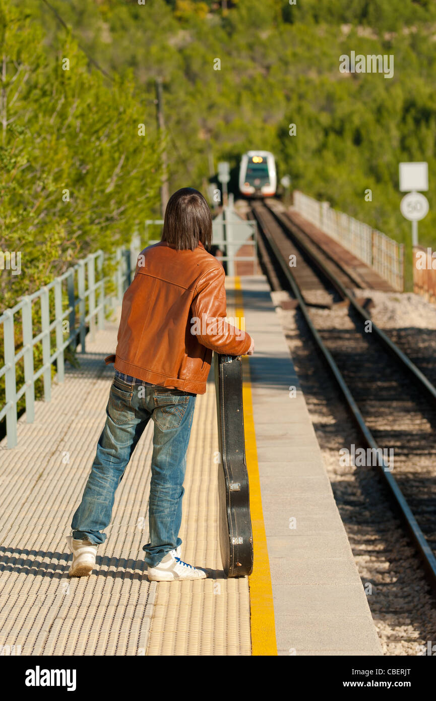 Commuter about to board an arriving train Stock Photo - Alamy