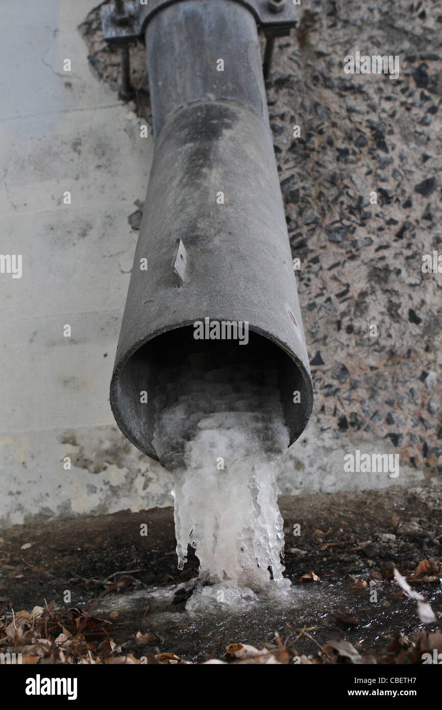 Frozen water coming out of a spout under a bridge in Minneapolis ...