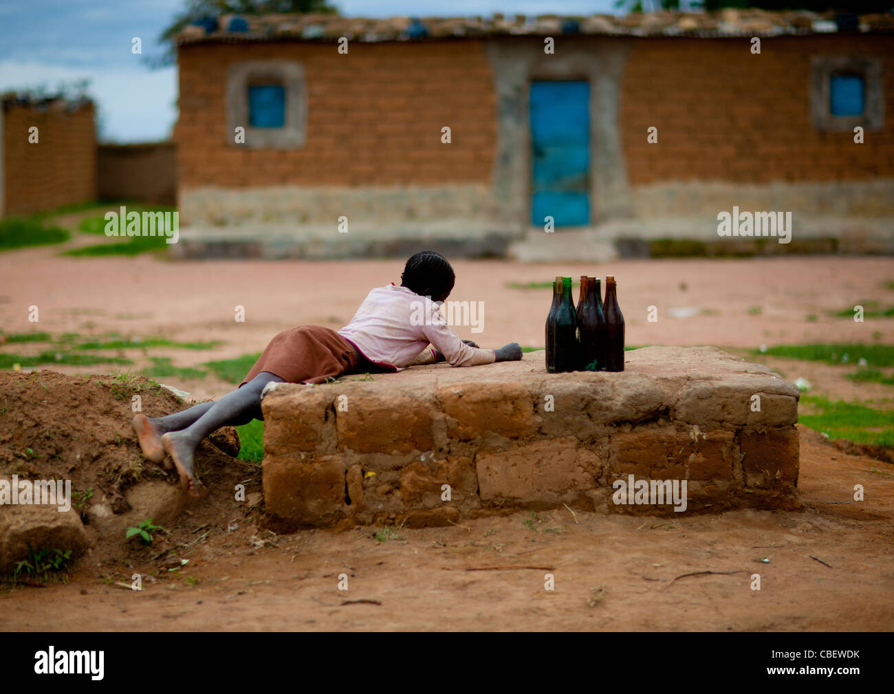Young Boy Selling Bottles Of Alcohol, Village Of Caconda, Angola Stock ...