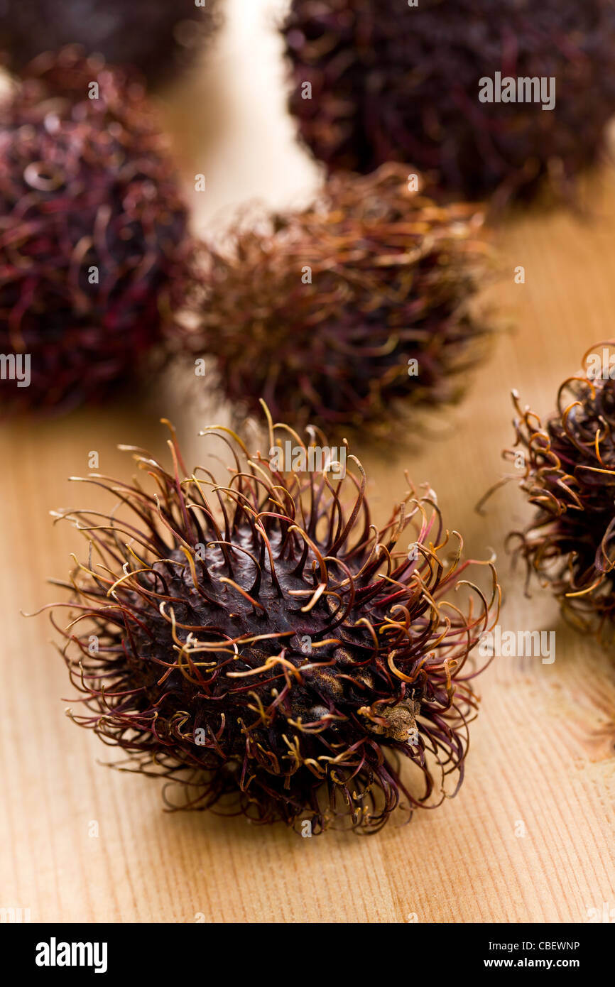 rambutan fruit on kitchen table Stock Photo - Alamy