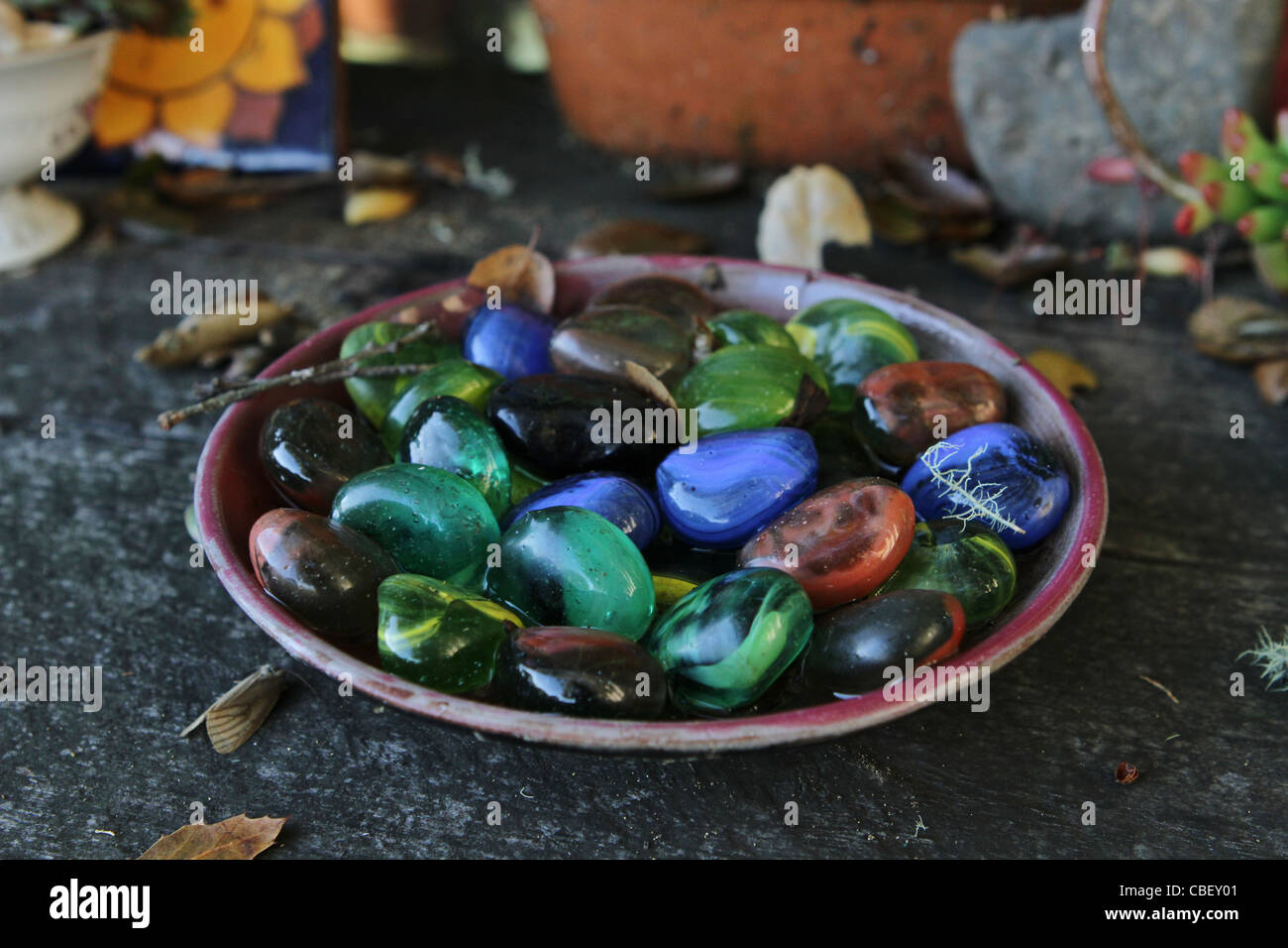 A bowl of colorful polished rocks Stock Photo - Alamy
