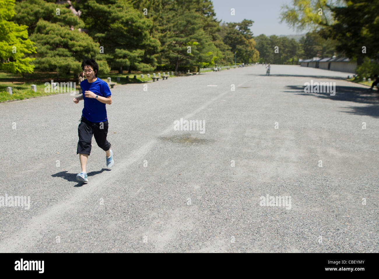 A man running in the grounds of Kyoto Imperial Palace, Japan Stock ...