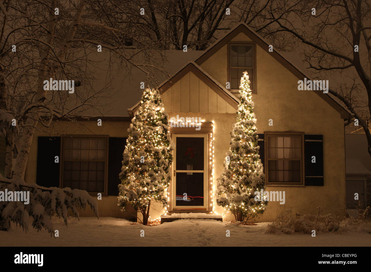 A house at night lit up with Christmas lights Stock Photo - Alamy