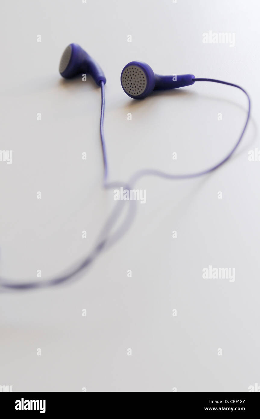 A pair of purple headphones on a white background Stock Photo - Alamy