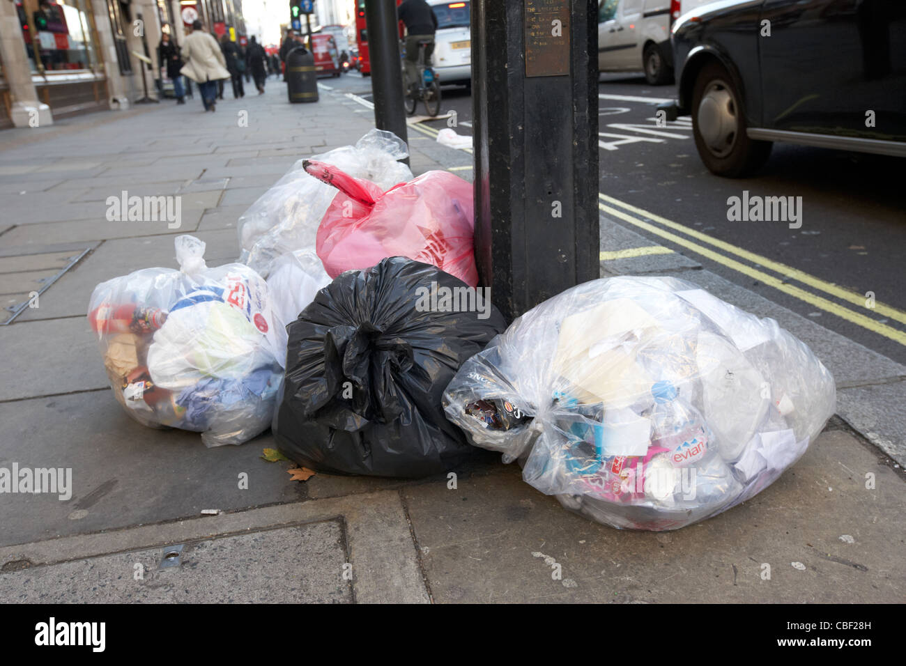 rubbish and litter left out in bags at the kerbside of a major london ...