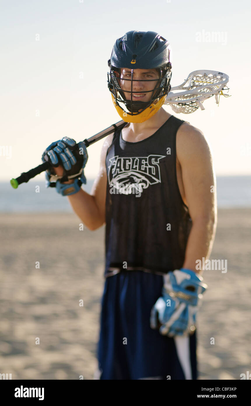 A portrait of a lacrosse athlete on the beach Stock Photo - Alamy