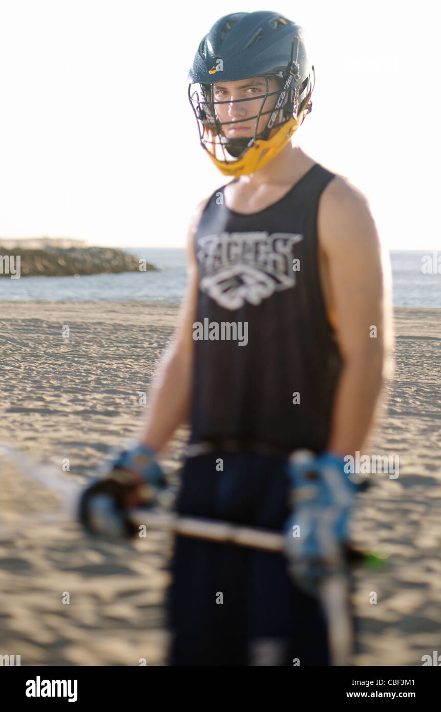 A portrait of a lacrosse athlete on the beach Stock Photo - Alamy
