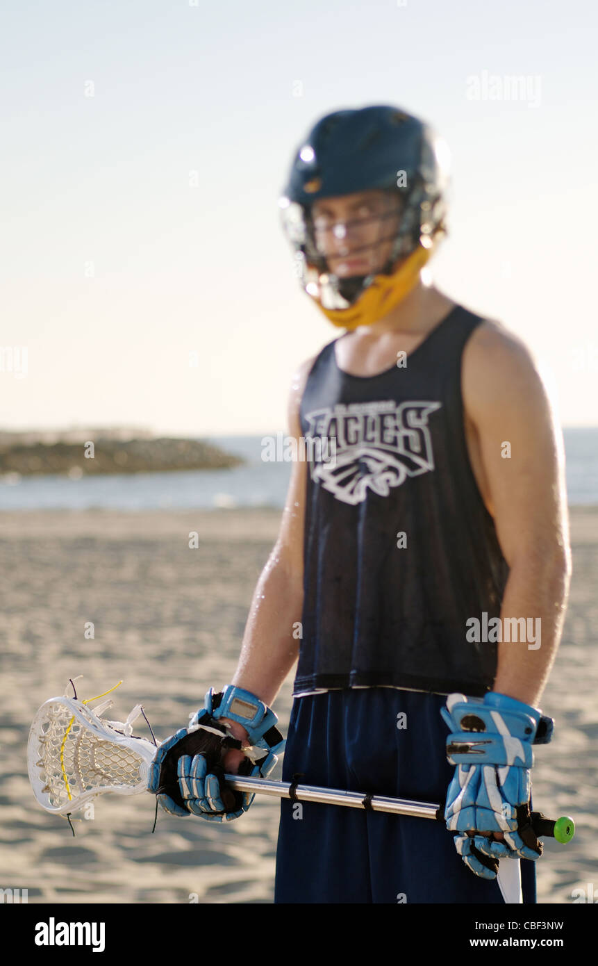 A portrait of a lacrosse athlete on the beach Stock Photo - Alamy