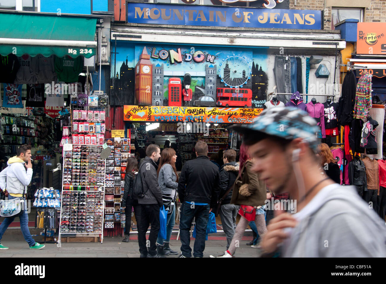 Busy Camden High Street scene with group of teenagers outside jeans ...
