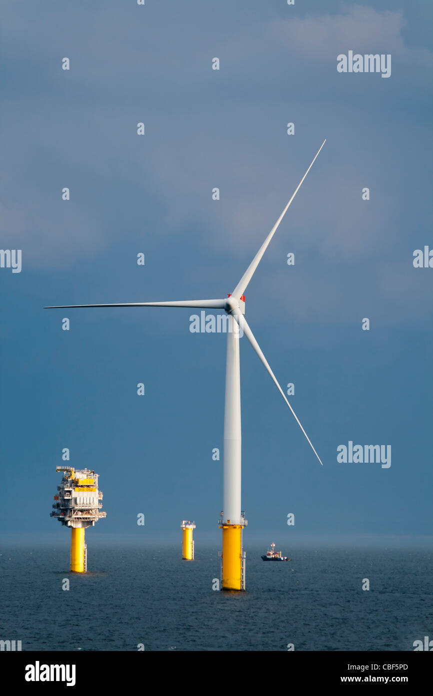Offshore wind turbine and a transformer substation in a windfarm under ...