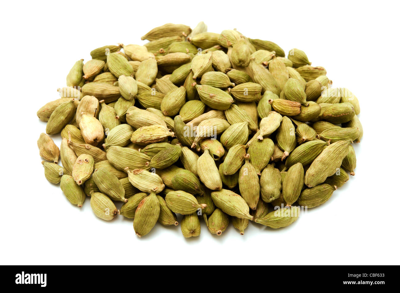 Green cardamom on a white background Stock Photo - Alamy