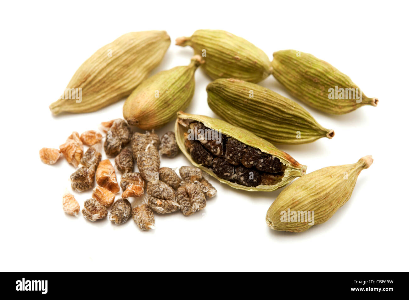 Green cardamom on a white background Stock Photo - Alamy
