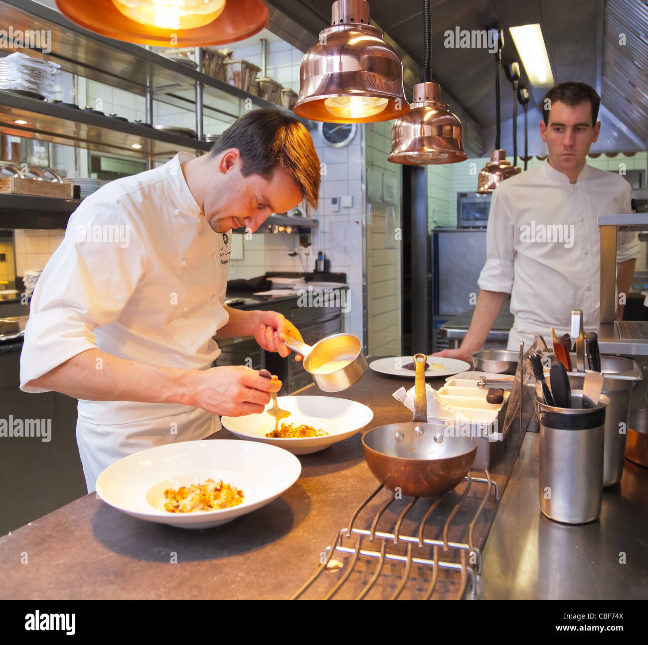 The Chef, Philippe Mille garnishing a recipe., Member of the "Relais ...