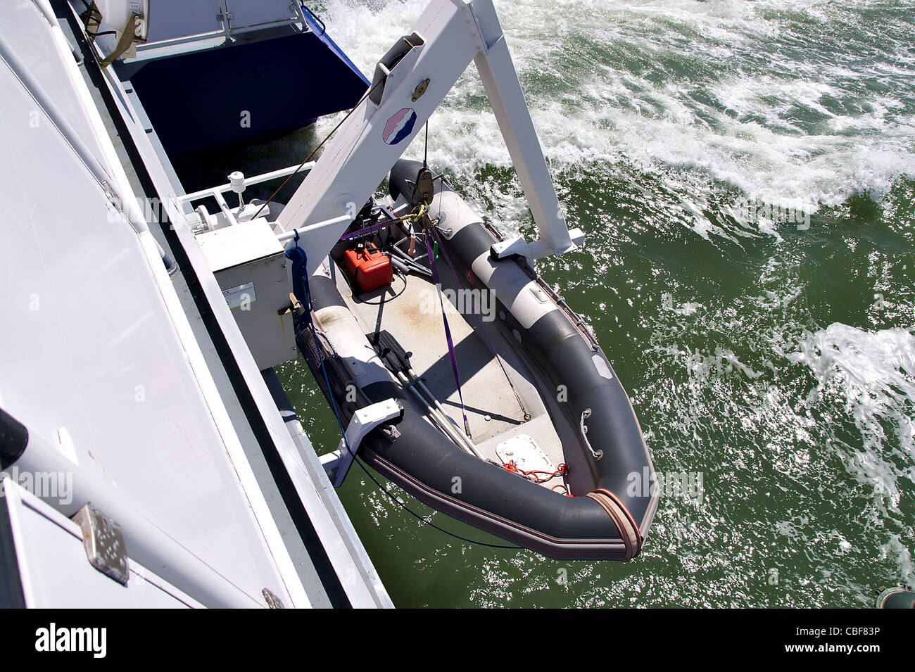 Life boat hanging ready to go in the water on hoovercraft ship hanging ...