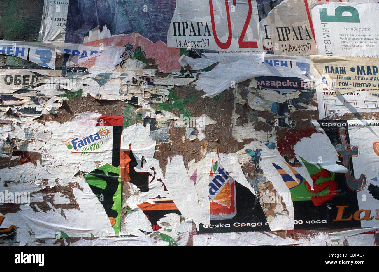 Colourful collage of old posters and bills on a city wall in Sofia ...
