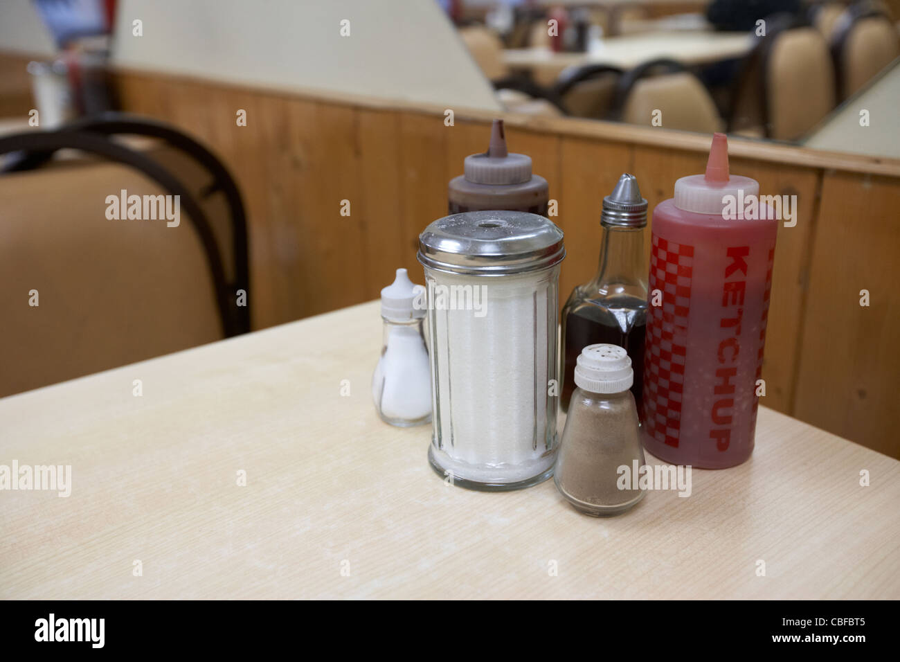 condiments sauces and sugar on a table in a cafe in london england ...