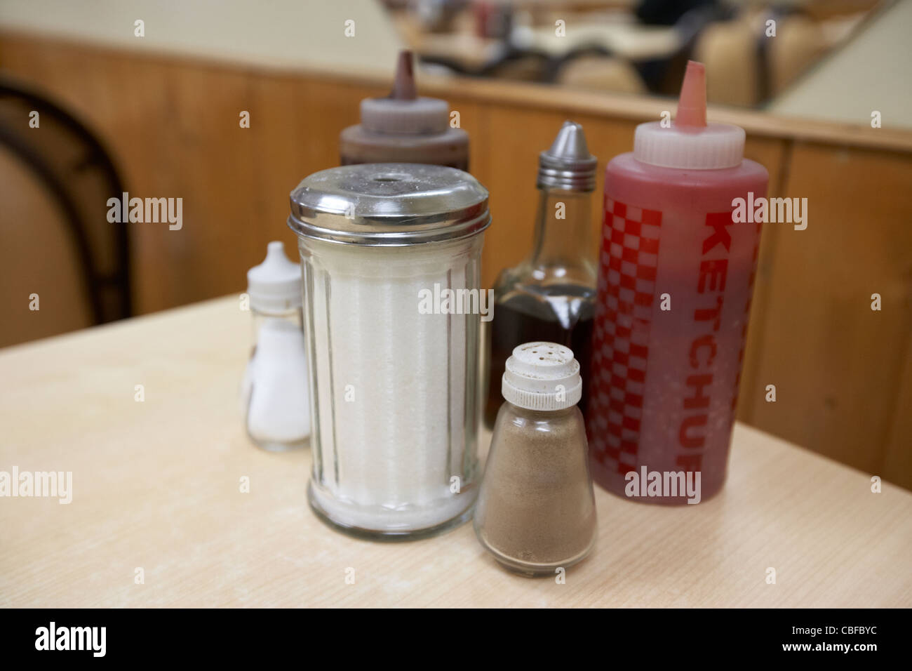 condiments sauces and sugar on a table in a cafe in london england ...
