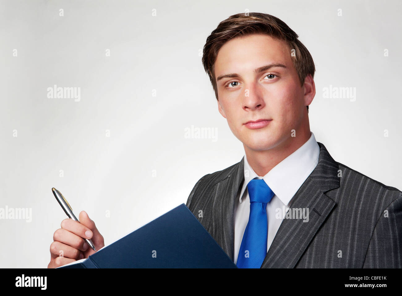 young business man taking note Stock Photo - Alamy
