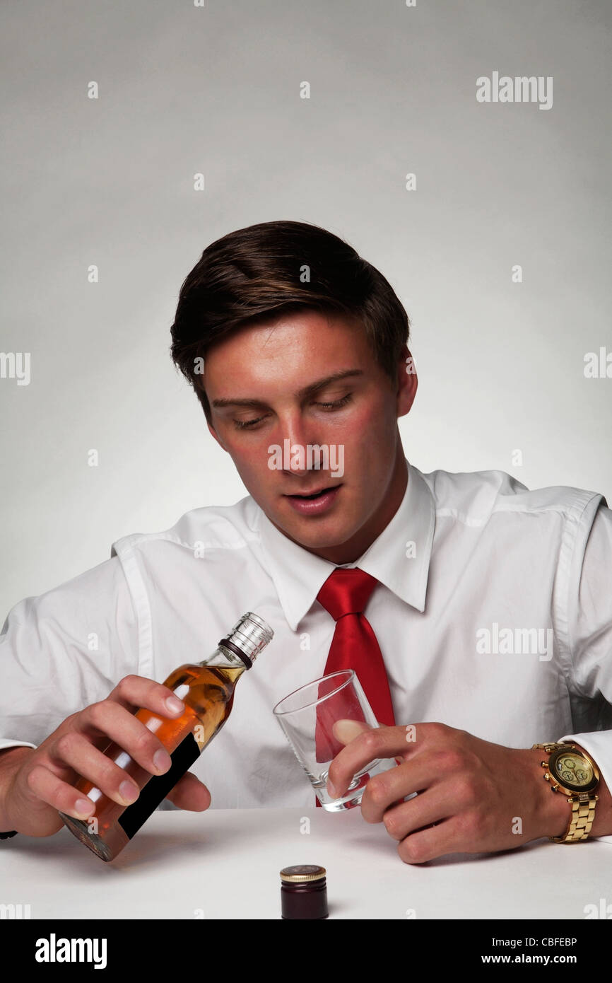 businessman having a drink at work Stock Photo - Alamy