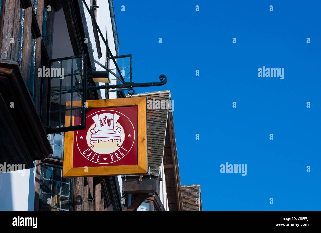Cafe Pret sign on the facade of a Tudor building in Canterbury Stock ...