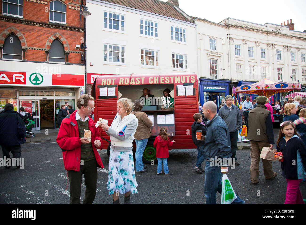 Louth Victorian Market, Lincolnshire, England people enjoying hot roast ...