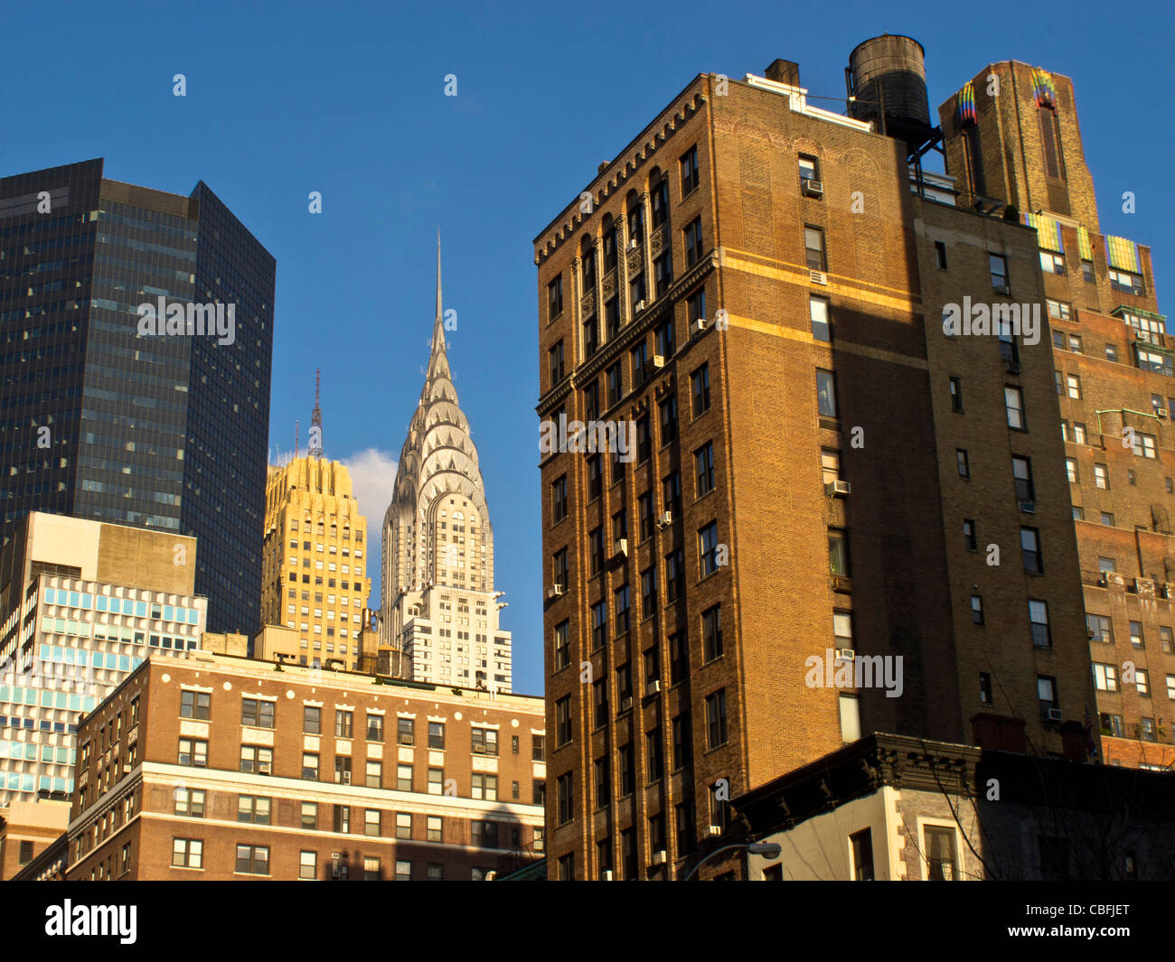 Top of Chrysler Building and Brownstone Building downtown Manhattan ...