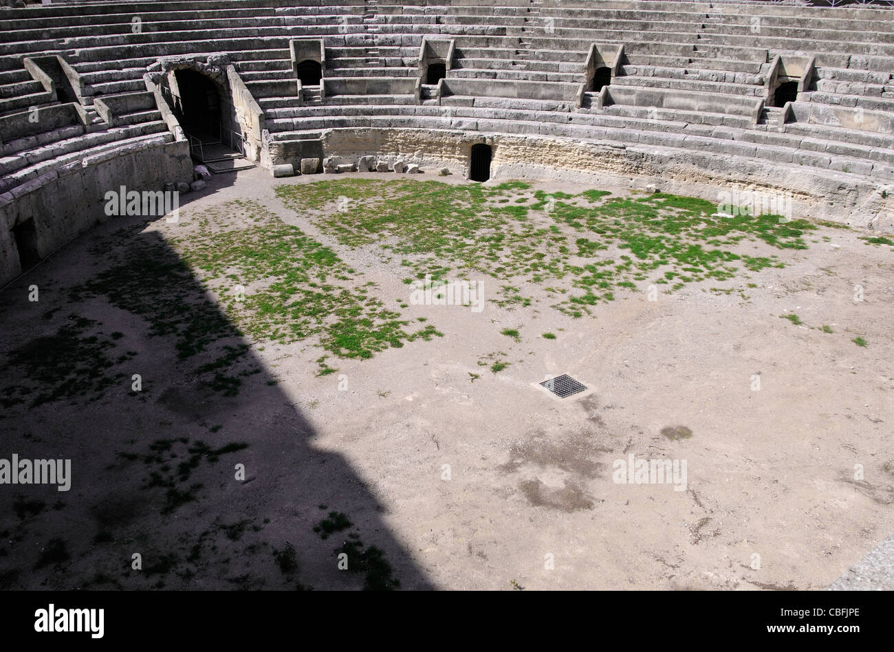 Old stone seats and central arena ring within Roman Amphitheatre Stock ...