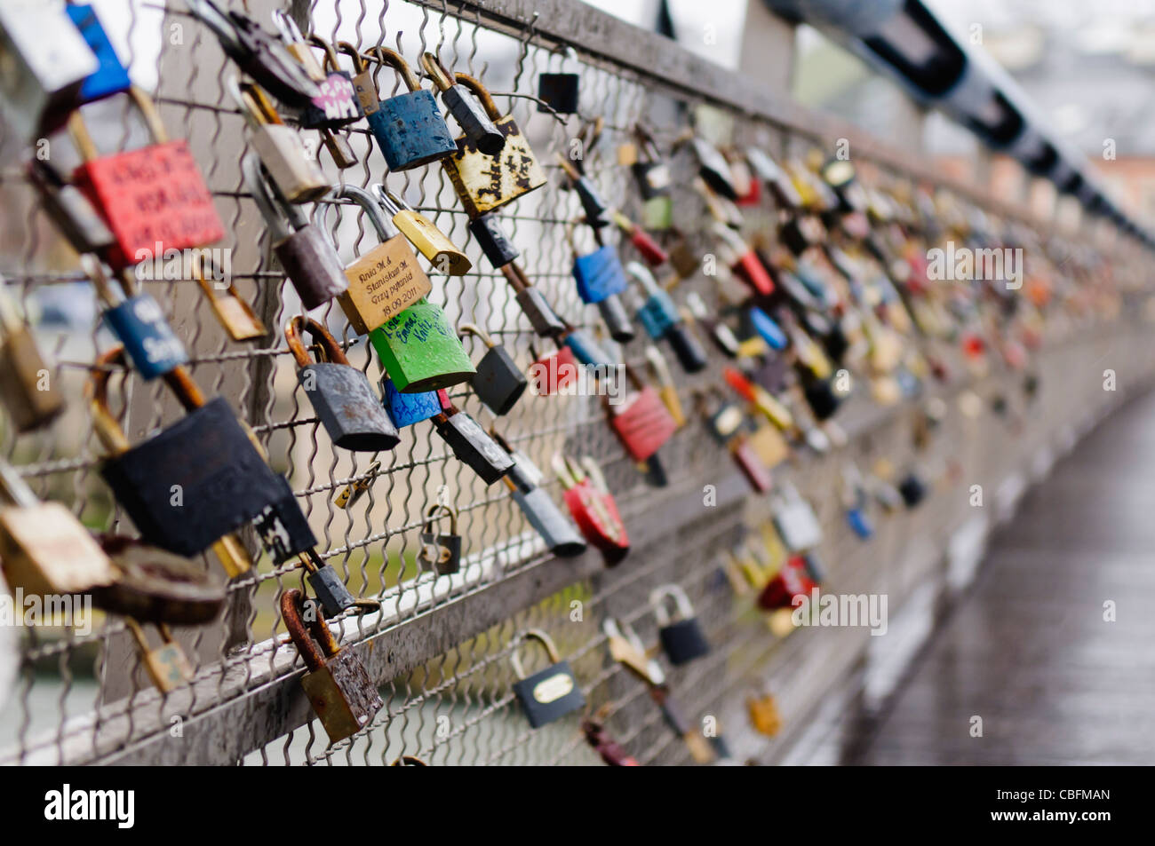 Locks with names of lovers attached to a bridge over the River Vistula ...