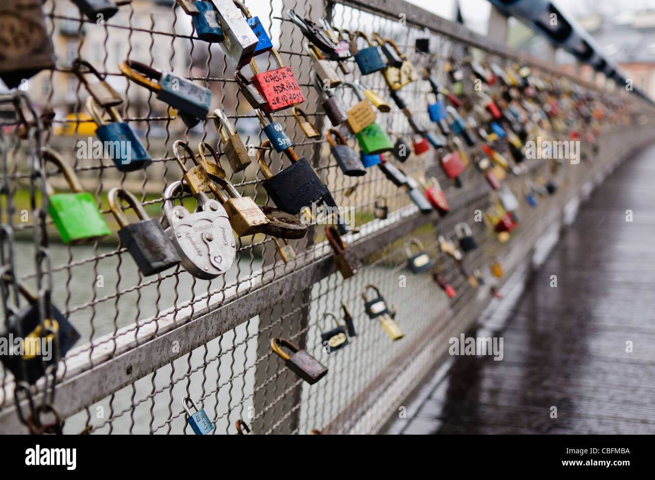 Locks with names of lovers attached to a bridge over the River Vistula ...