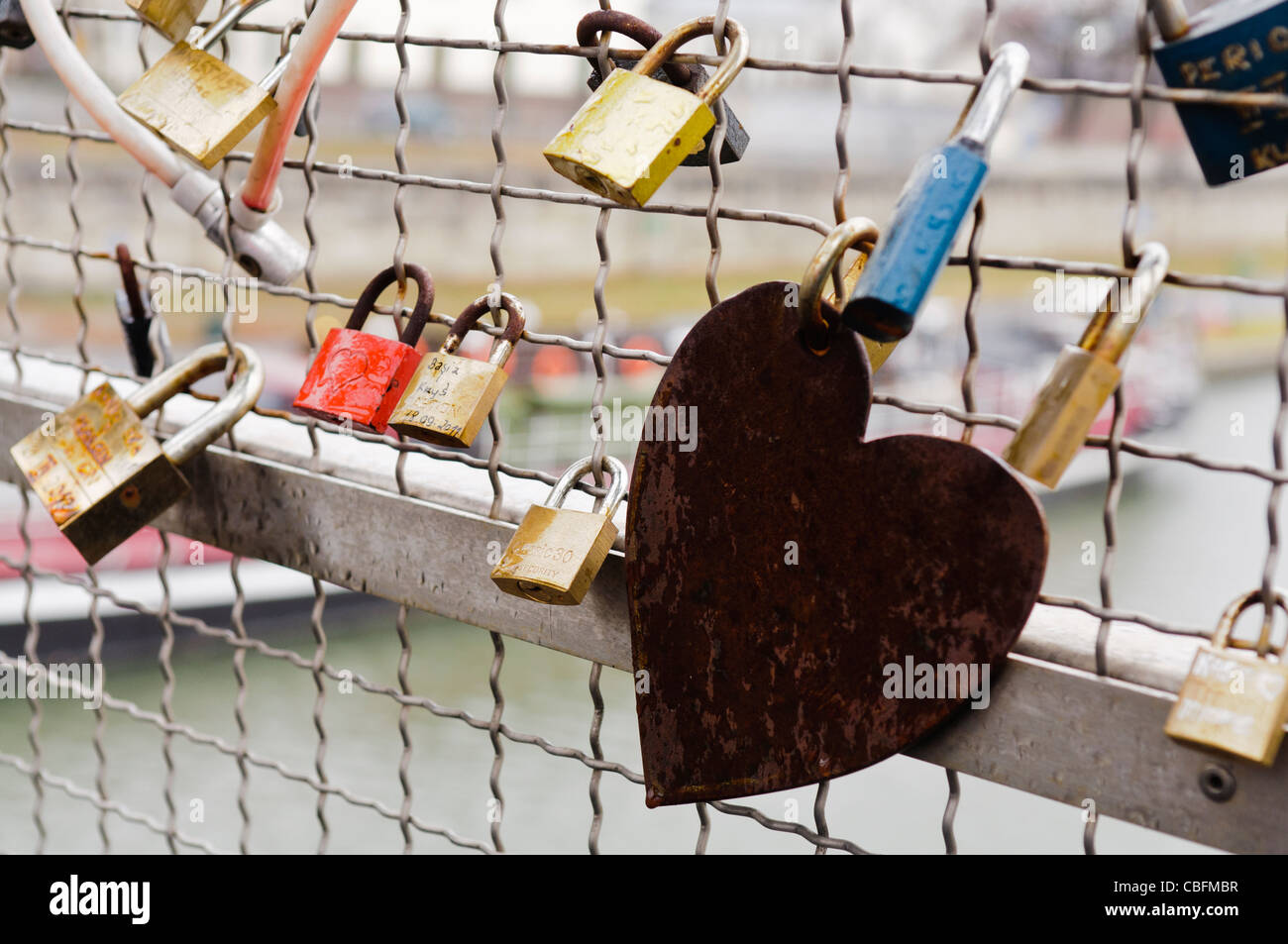 Locks with names of lovers attached to a bridge over the River Vistula ...
