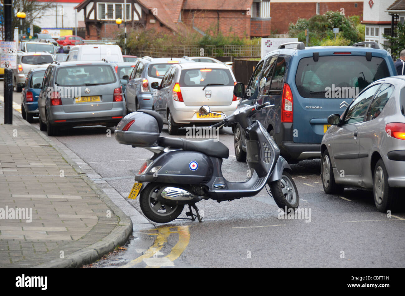 Scooter parked on the side of a road, Bristol, UK Stock Photo - Alamy