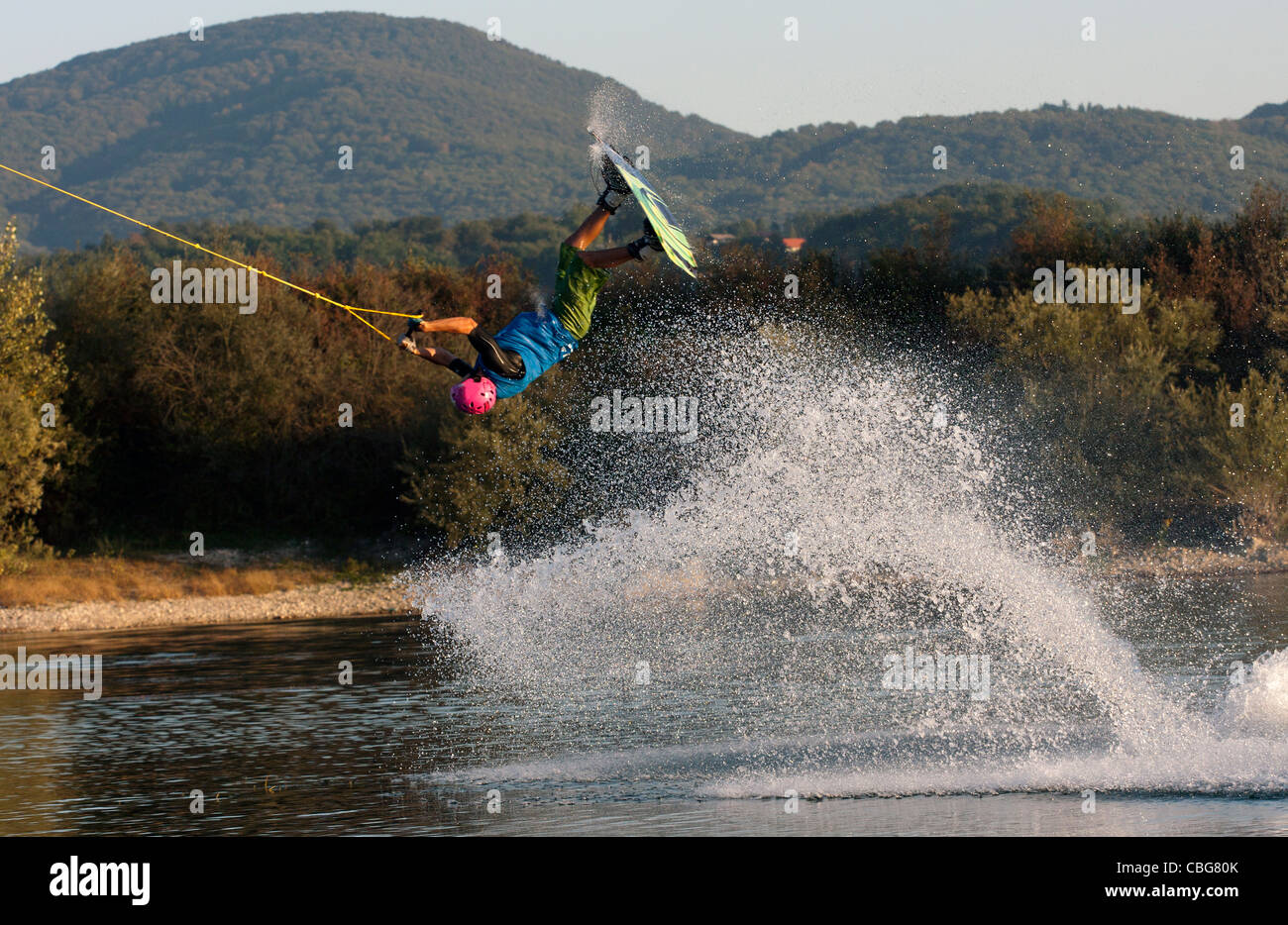 Wakeboarder preforming an acrobatic jump Stock Photo - Alamy