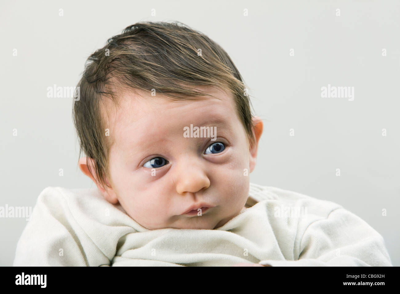 A newborn baby looking contemplative Stock Photo - Alamy