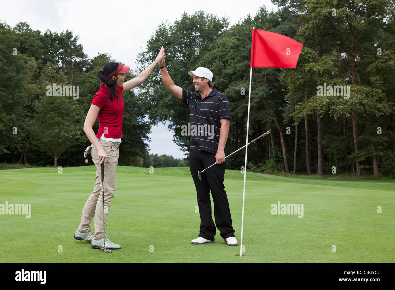 Woman putting red cap on hi-res stock photography and images - Alamy
