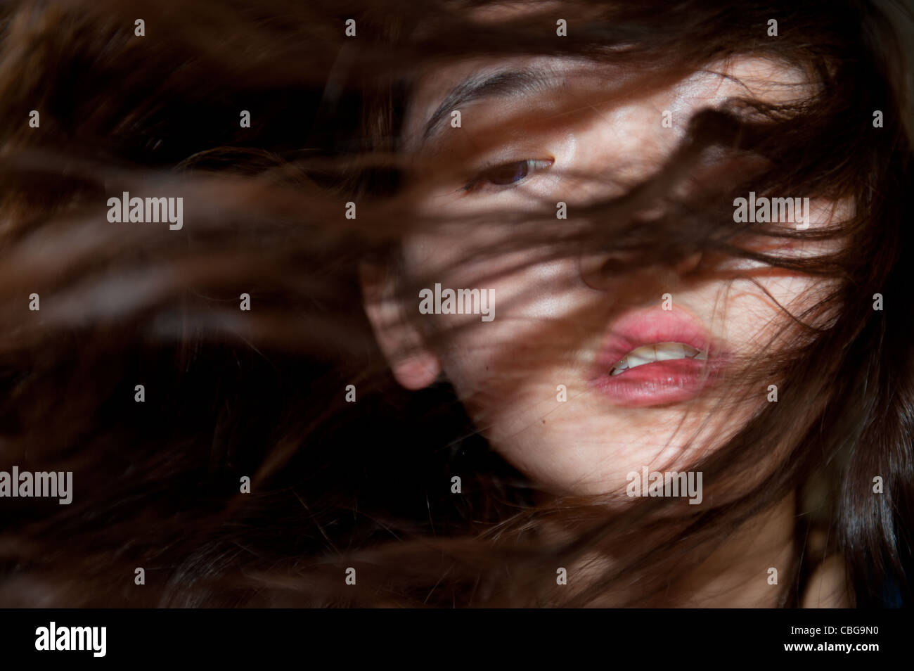 Headshot moving her hairs hi-res stock photography and images - Alamy