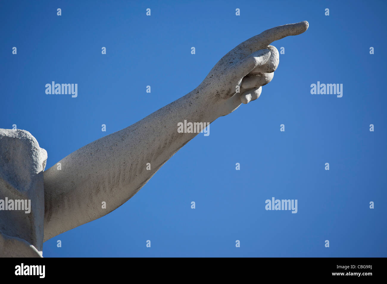 Statue pointing, blue sky background, close-up of arm Stock Photo - Alamy
