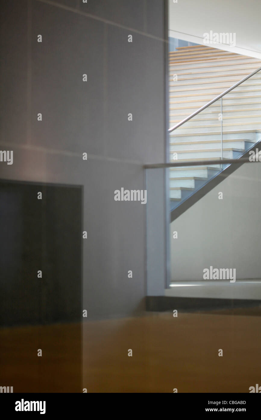 Corridor, floor and wall viewed through window, making geometric shapes ...